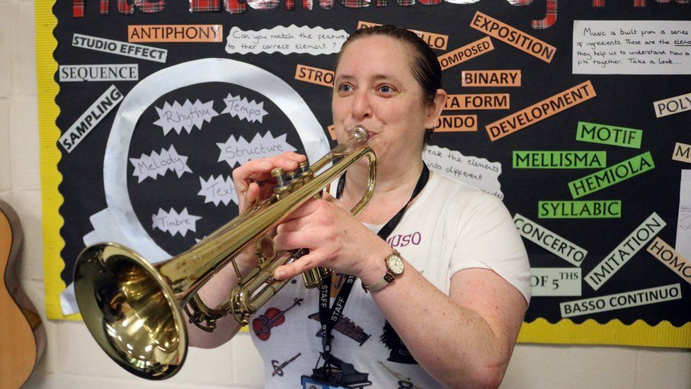 Music teacher takes nine exams on nine instruments in one day - BBC News