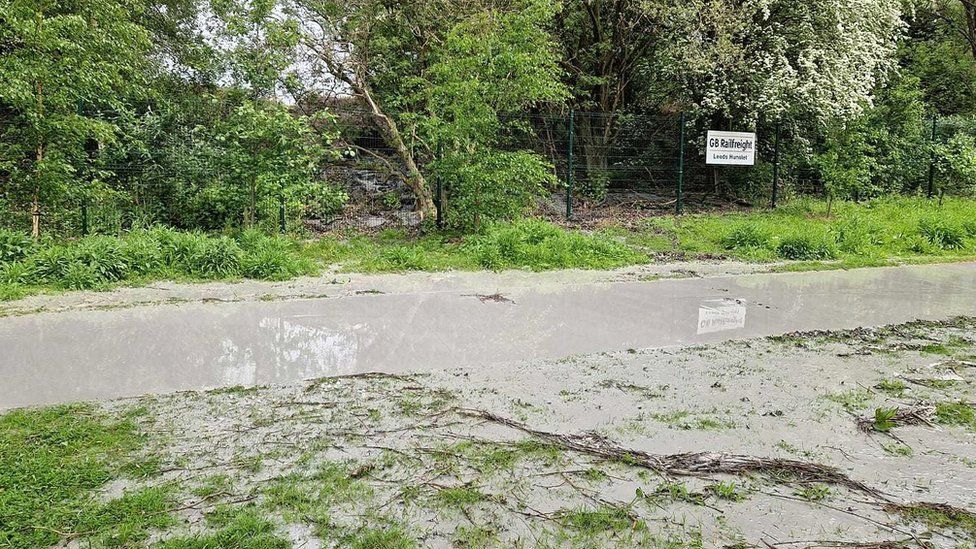 Leeds mystery riverside sludge leak under control, says council - BBC News