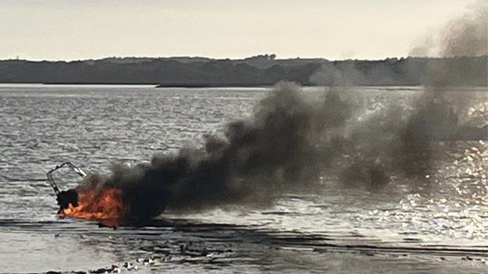 People rescued after boat catches fire in Poole Harbour - BBC News