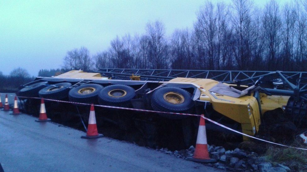 Road closed for toppled crane recovery - BBC News