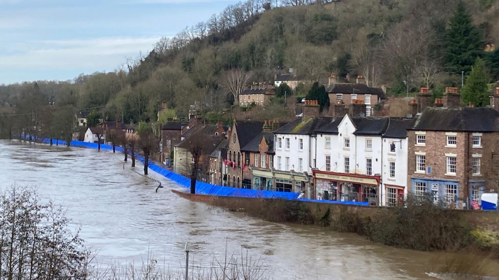 Shropshire flood barriers come down as clean-up begins - BBC News