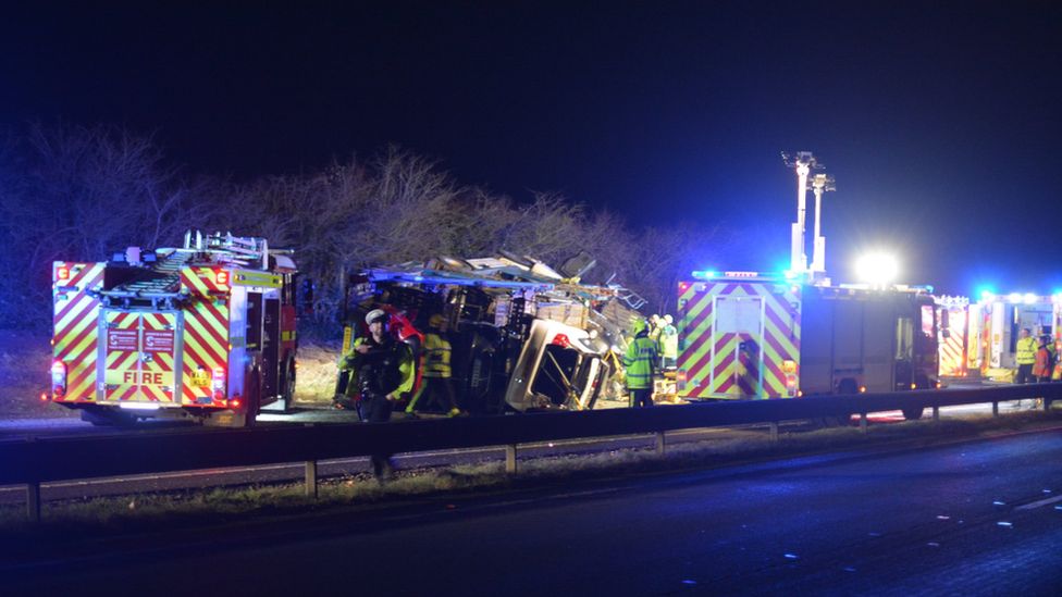 Twelve cars destroyed when transporter overturns in Devon - BBC News