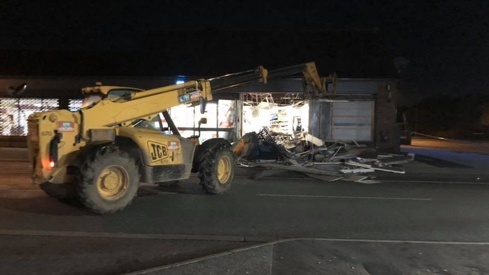 Cash machine ripped out in JCB ram-raid - BBC News