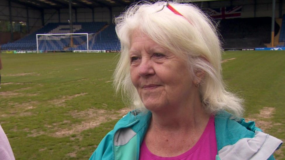 Bury FC: Service for fans whose ashes are scattered on pitch - BBC News