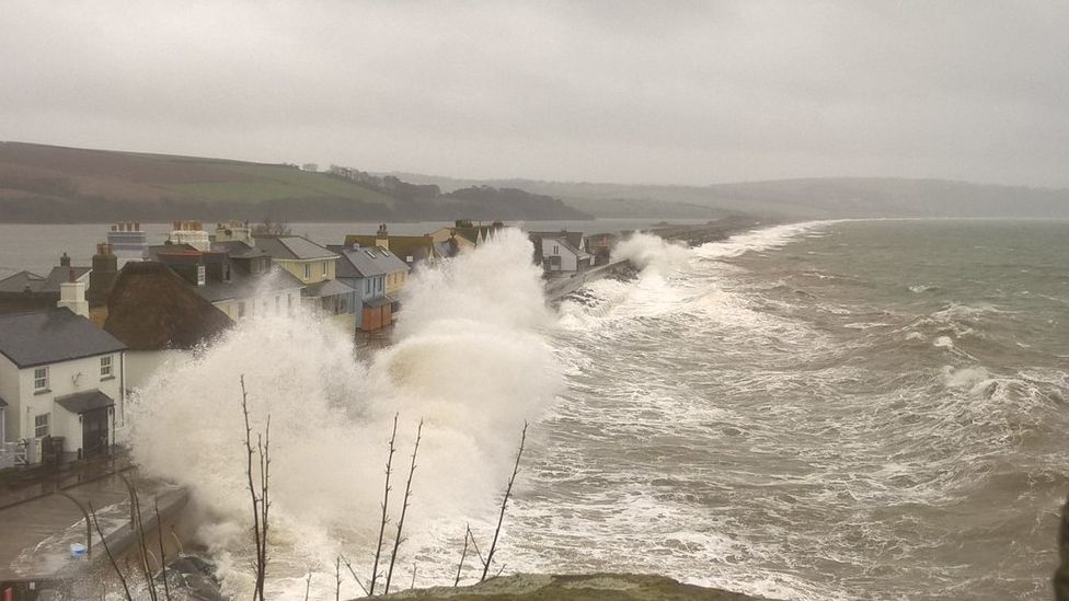 Evacuation as crack appears in Devon sea defences - BBC News