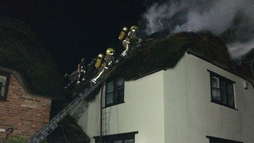 Fire crews tackle Lytchett Matravers thatch fire - BBC News