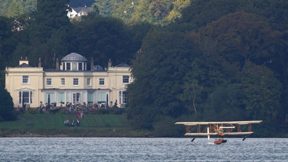 Waterbird: Replica of UK's first seaplane flies over Windermere - BBC News