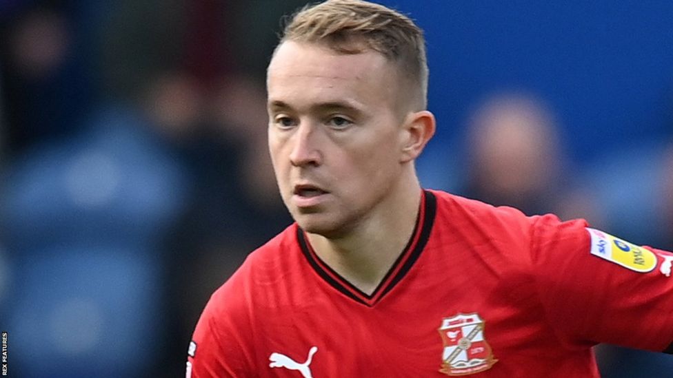 Louis Reed: Mansfield sign Swindon midfielder for undisclosed fee - BBC ...