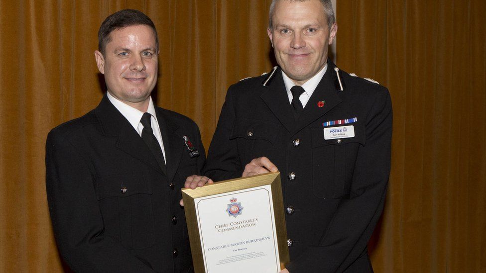 Wigan policeman given award for saving suicidal man - BBC News