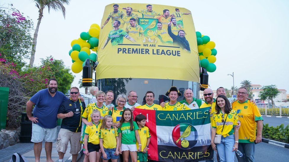 Norwich City fans stage open-top bus parade in Dubai - BBC News