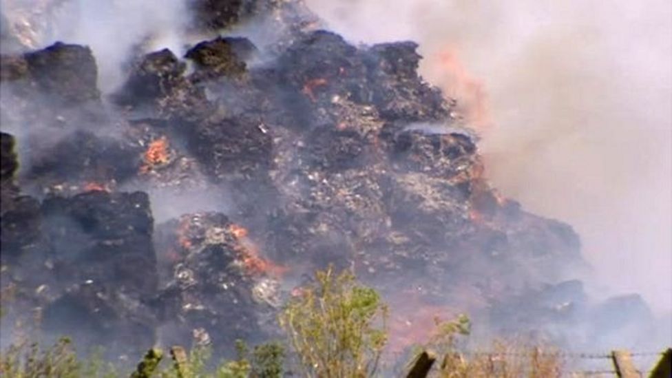 Staff help fire crews with Ancaster recycling fire clean-up - BBC News