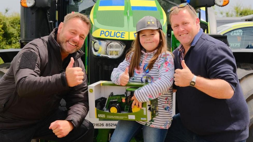 Girl, 7, wins contest to name Devon and Cornwall Police tractor - BBC News