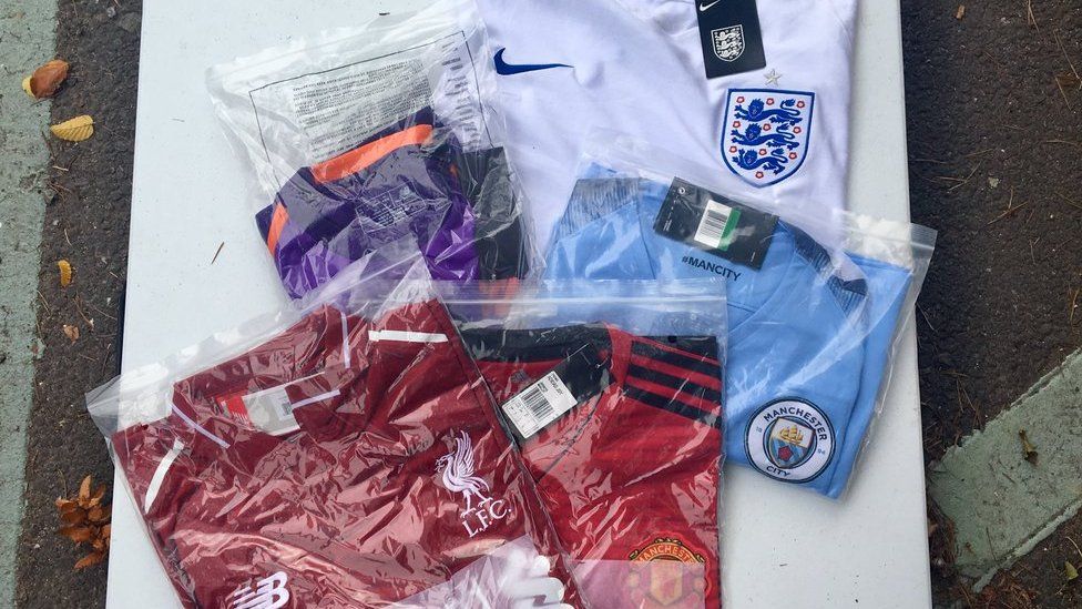 Football shirts amongst counterfeit goods seized in Shropshire - BBC News