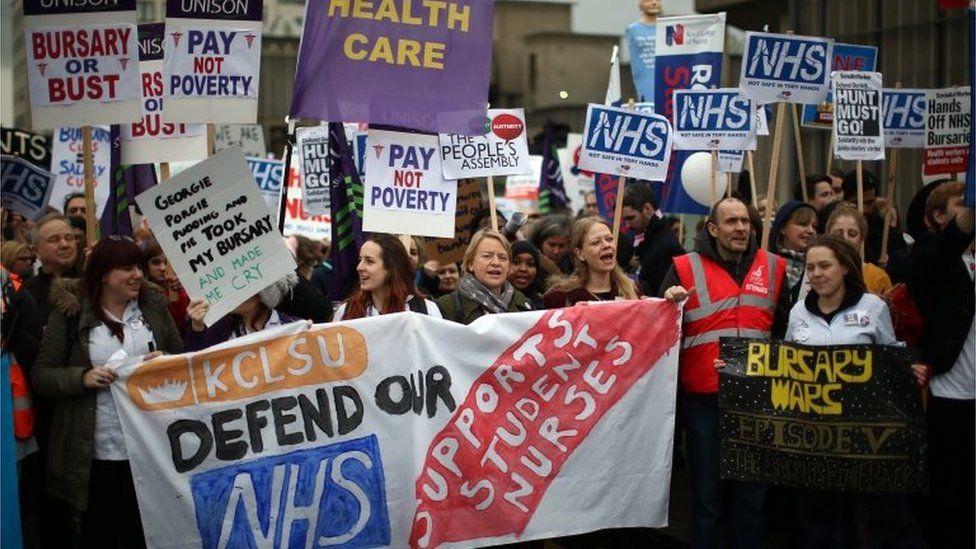 Student nurses and midwives protest over grants cut - BBC News