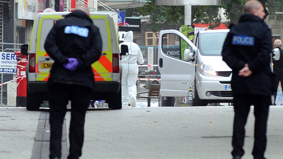 Cardiff Queen Street: Murder arrest after double stabbing - BBC News