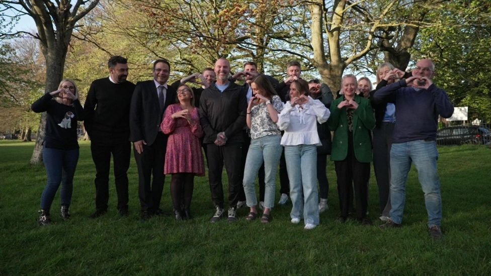 Runner reunited with doctors who saved him after street collapse - BBC News