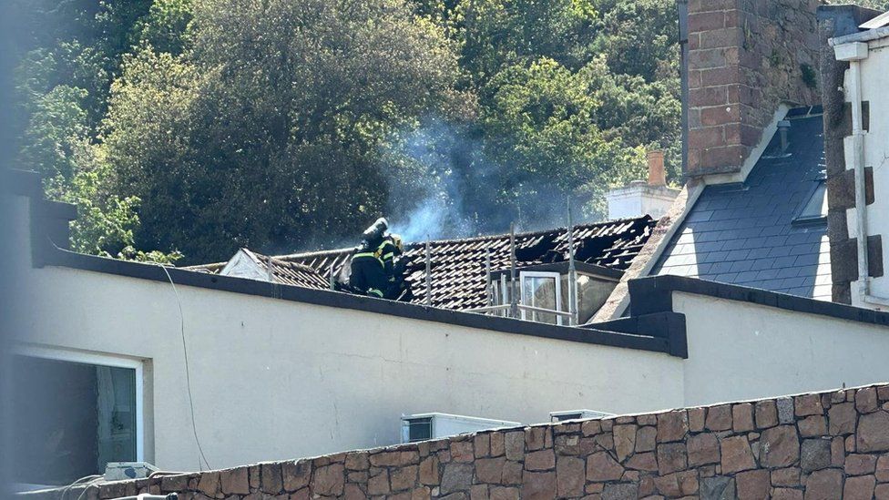 Fire crews tackle large blaze in Jersey building - BBC News