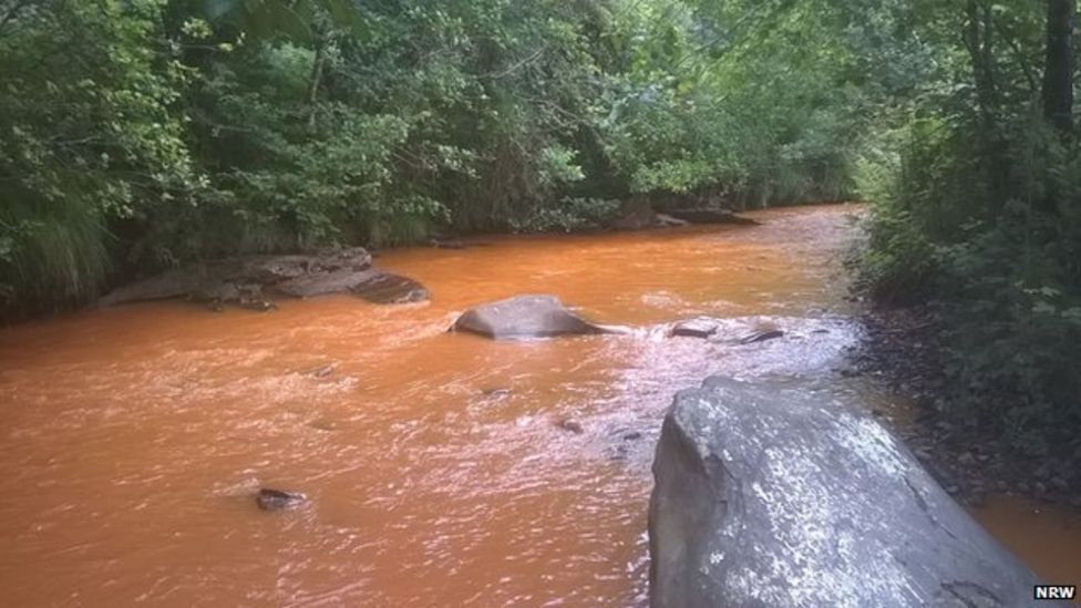 Rivers turn orange in Pontrhydyfen prompting investigation - BBC News