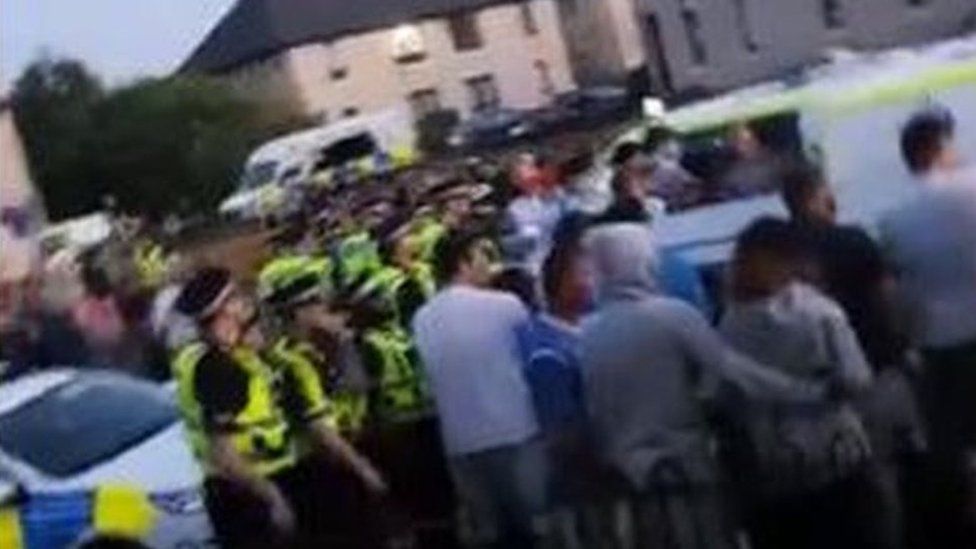 Arrests after mob targets man's house - BBC News