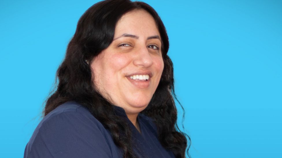 Blind police accountant who is 'real role model' becomes MBE - BBC News