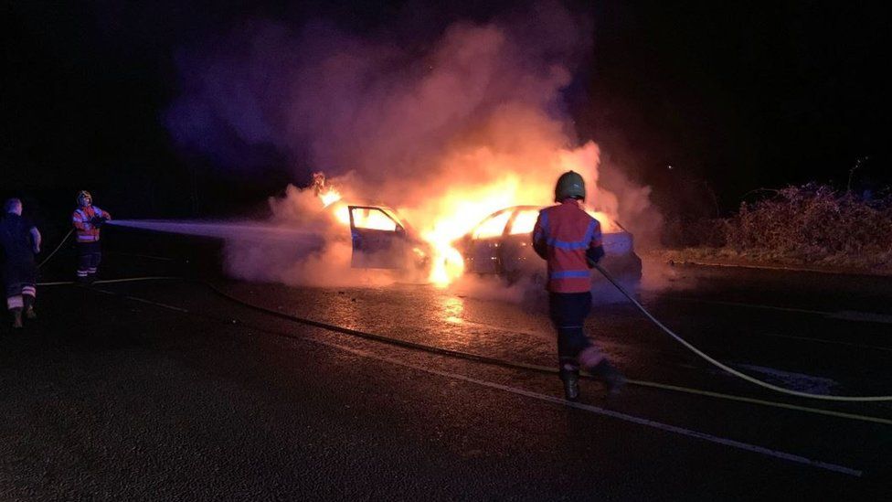 A141 March car crash leaves two cars in flames - BBC News