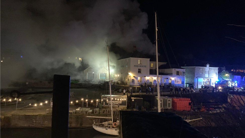 Hotel guests evacuated due to Charlestown harbourside fire - BBC News