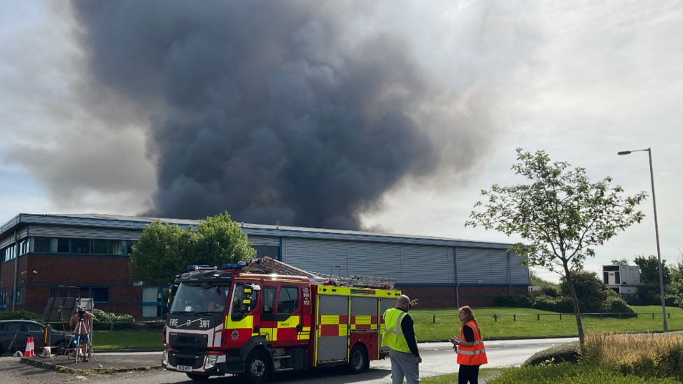 Large Cannock parcel centre fire causes huge smoke plume - BBC News
