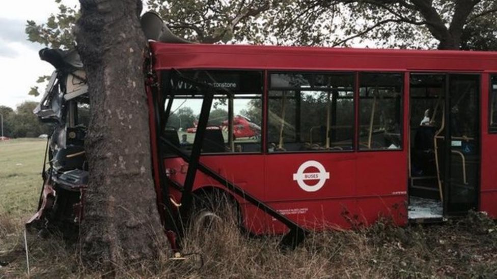 Two passengers trapped as bus hits tree in east London - BBC News
