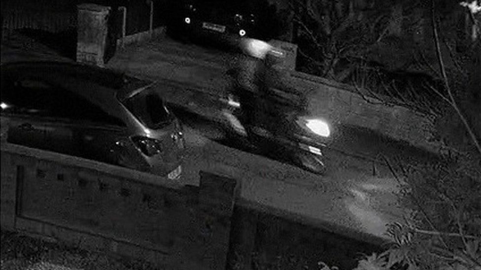 CCTV images of man firing sawn-off shotgun at Bolton house - BBC News