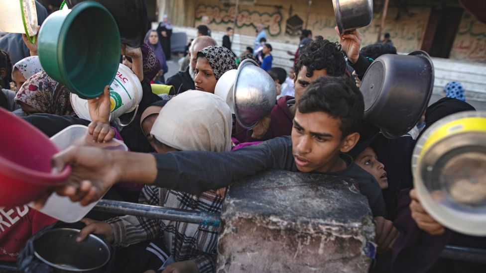 Israel-Gaza: Aid reaches Gaza shore in first sea delivery - BBC News