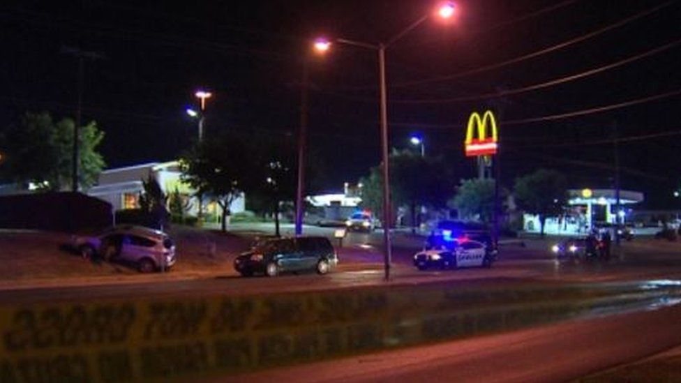 Texas mother shoots man trying to steal car with children inside - BBC News