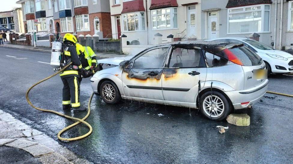 Plymouth 'hero' pair stop runaway flaming car - BBC News