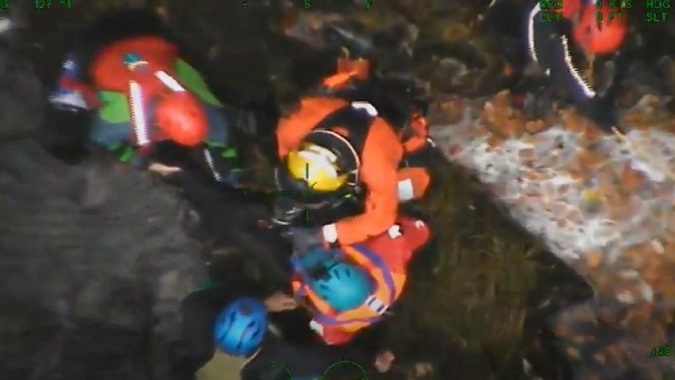 Injured kayaker rescued in white-water conditions - BBC News