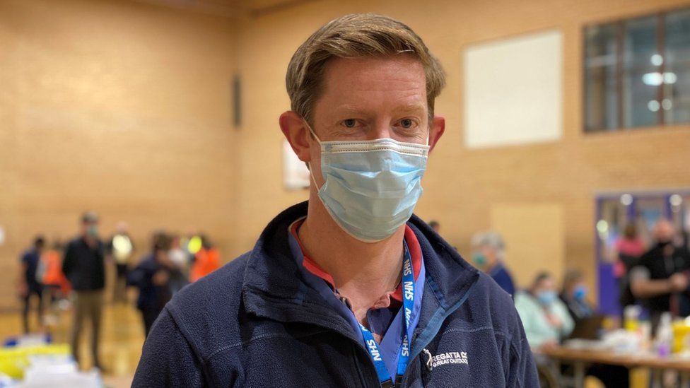 Covid booster jabs: 'We're all tired but it is so important' - BBC News