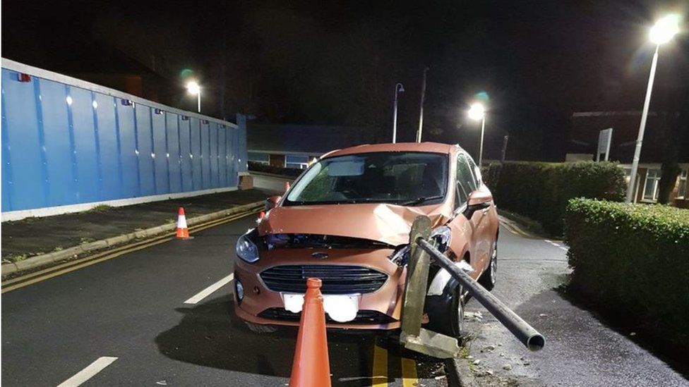 Railing impales car in Swansea, narrowly avoids driver - BBC News