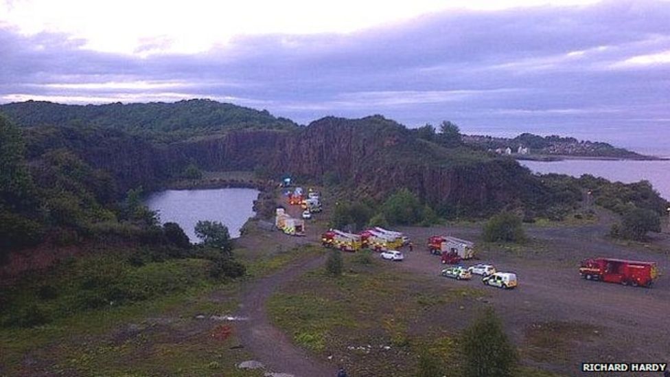 Divers find body after quarry search for teenager - BBC News