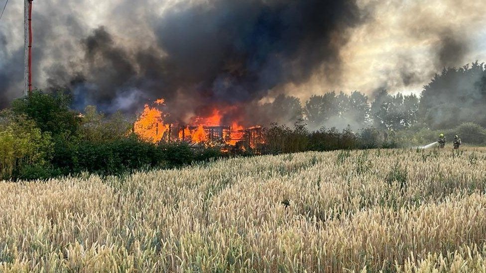 Witham: Four buildings destroyed in suspected arson - BBC News