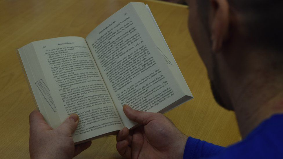Helping prisoners learn to read inside Swansea prison - BBC News