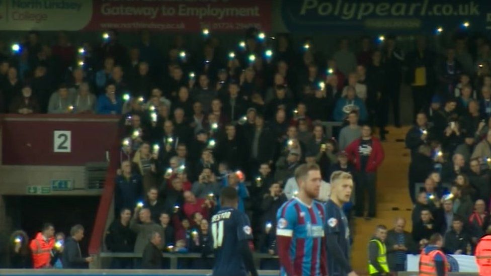 Scunthorpe fans show support for Tata Steel workers - BBC News