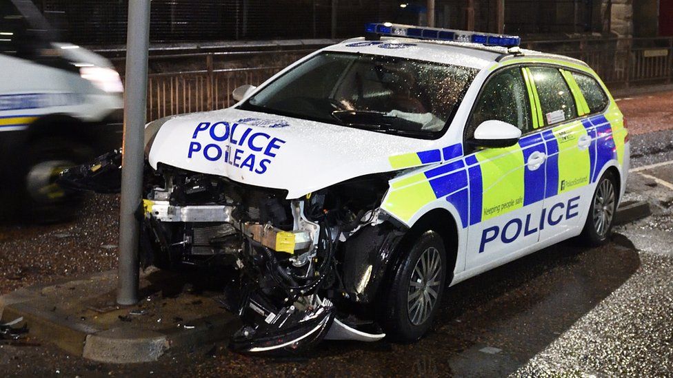 Police car extensively damaged after traffic light crash - BBC News