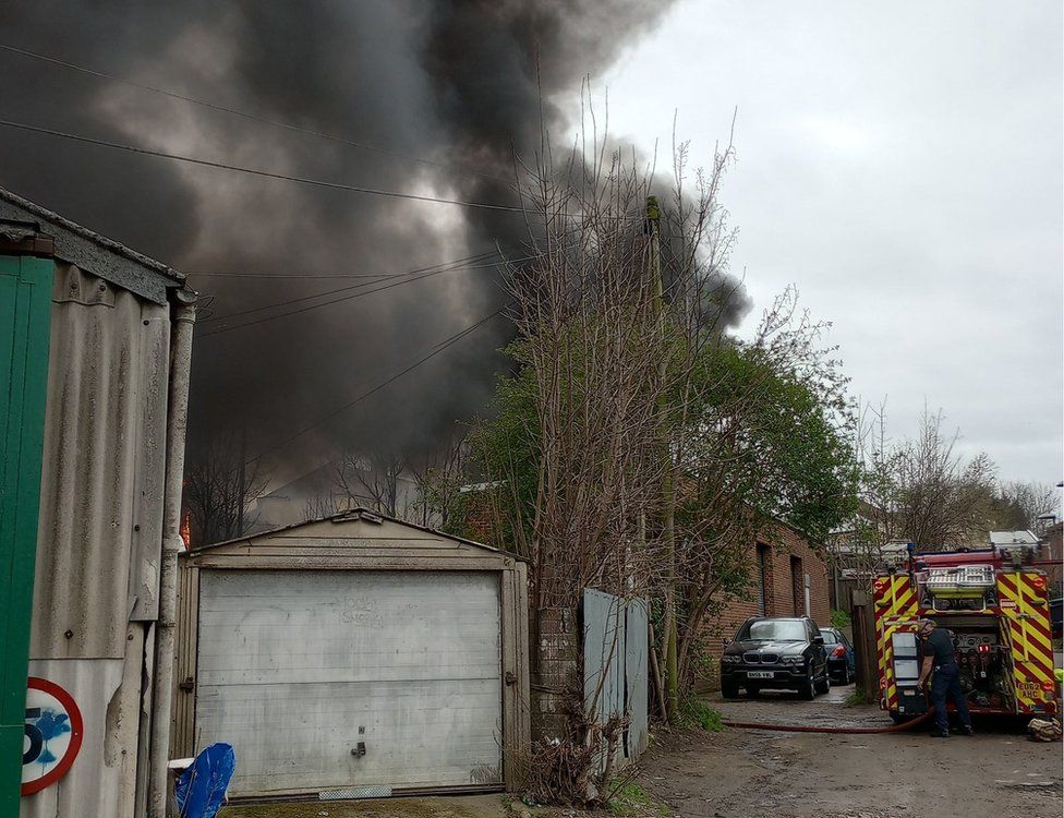 Kent Fire crews tackle commercial garage blaze in Strood - BBC News