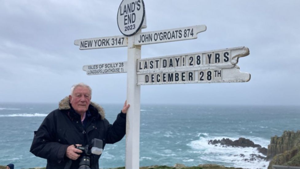 Land's End signpost photographer retires aged 79 - BBC News