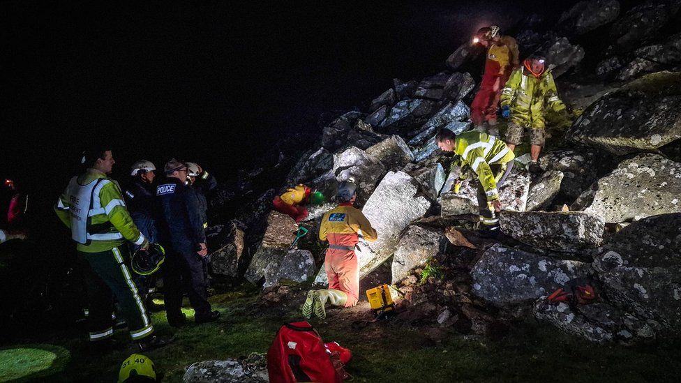 Dog rescued from Haytor quarry at Dartmoor after seven hours - BBC News
