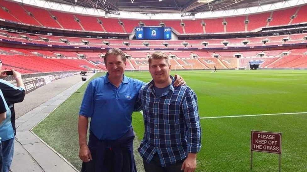Wycombe Wanderers fan Mark Bird dies after falling ill at ground - BBC News