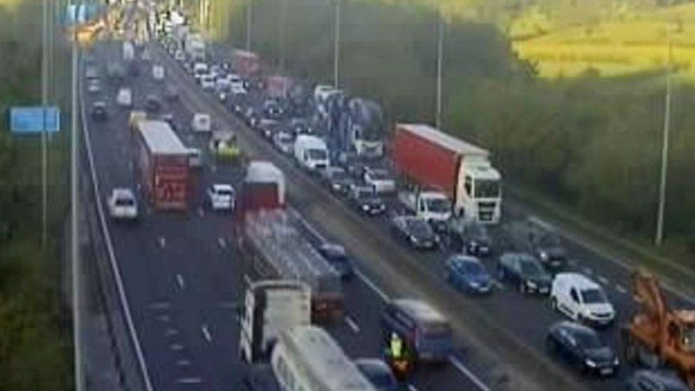 Brighouse: M62 reopens after car hits central reservation - BBC News