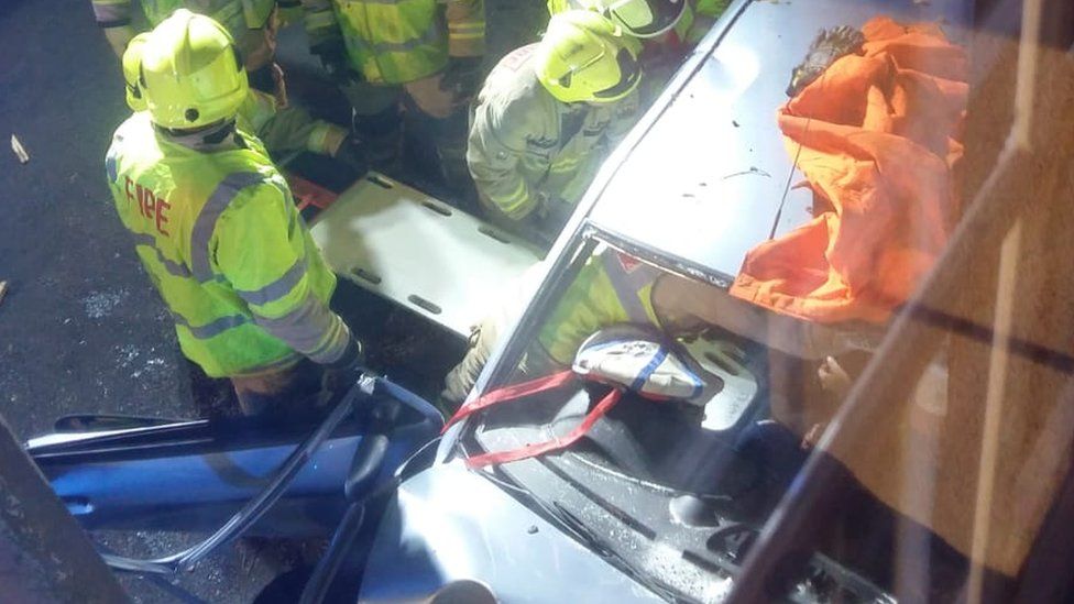 Car crashes into lamp-post outside couple's Treharris home - BBC News