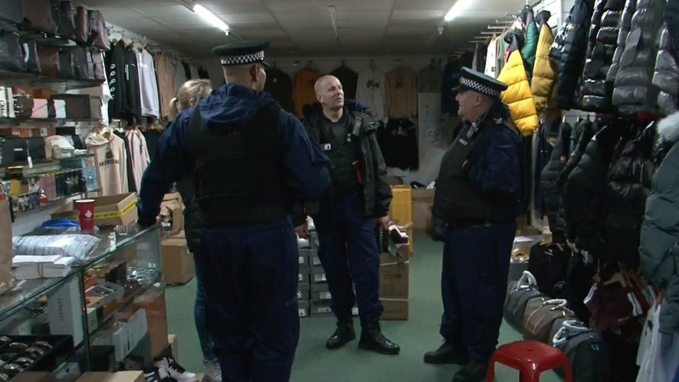 Police seize 20 tonnes of counterfeit goods in Manchester raids - BBC News