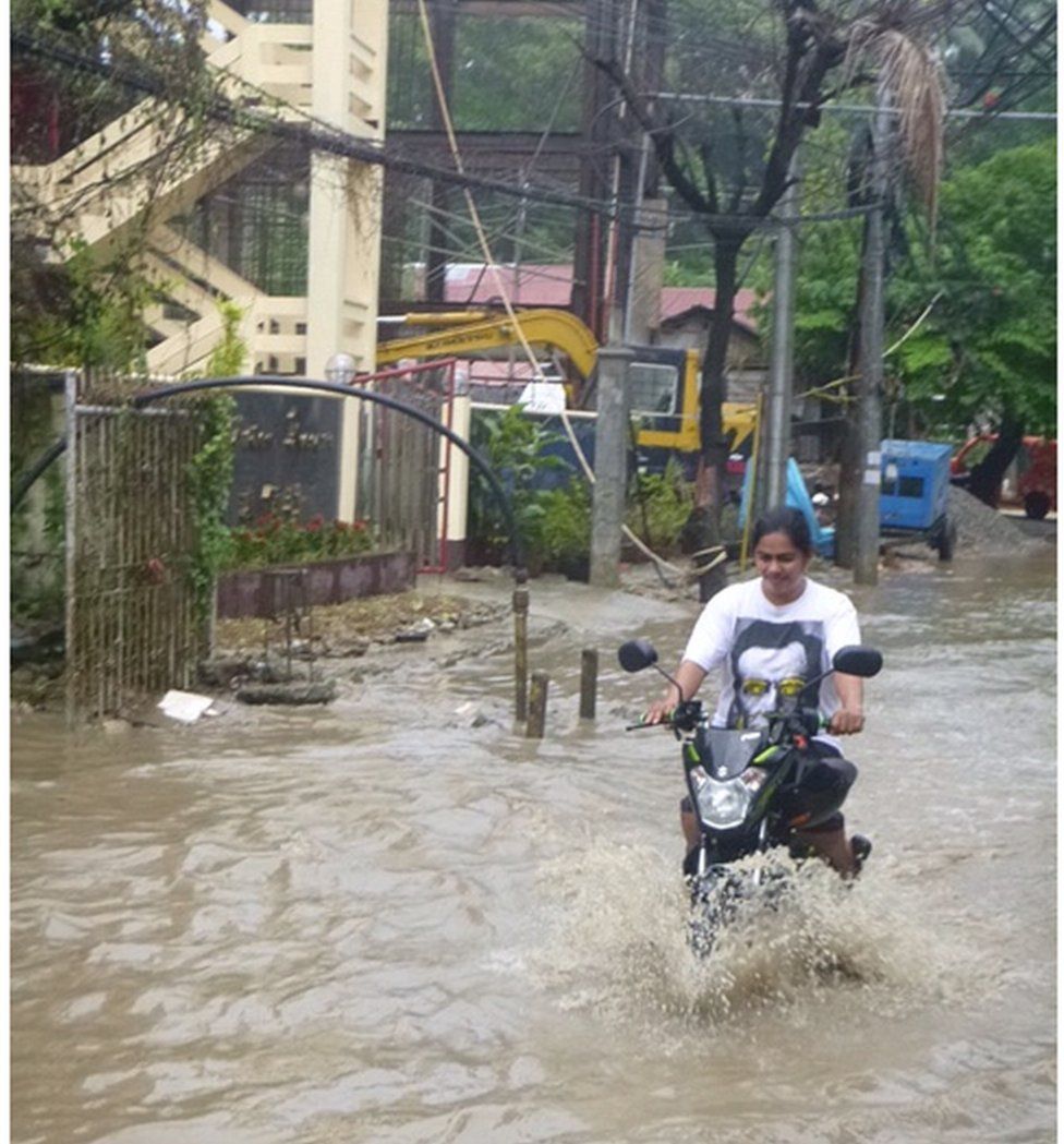 'There's a typhoon outside my hotel room' - BBC News