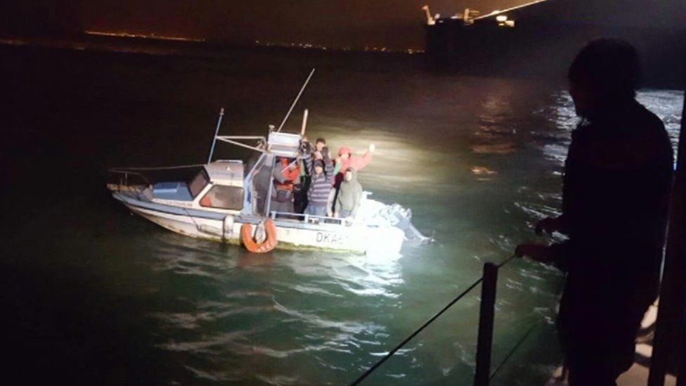 Toddler among nine rescued from dinghy off Dover coast - BBC News