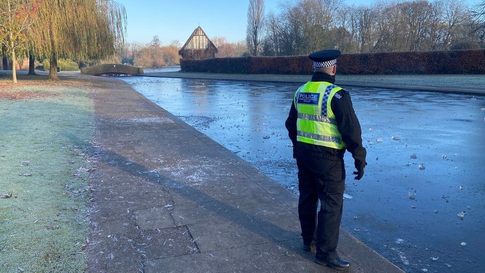 Rotherham: Woman and dog rescued from frozen lake - BBC News